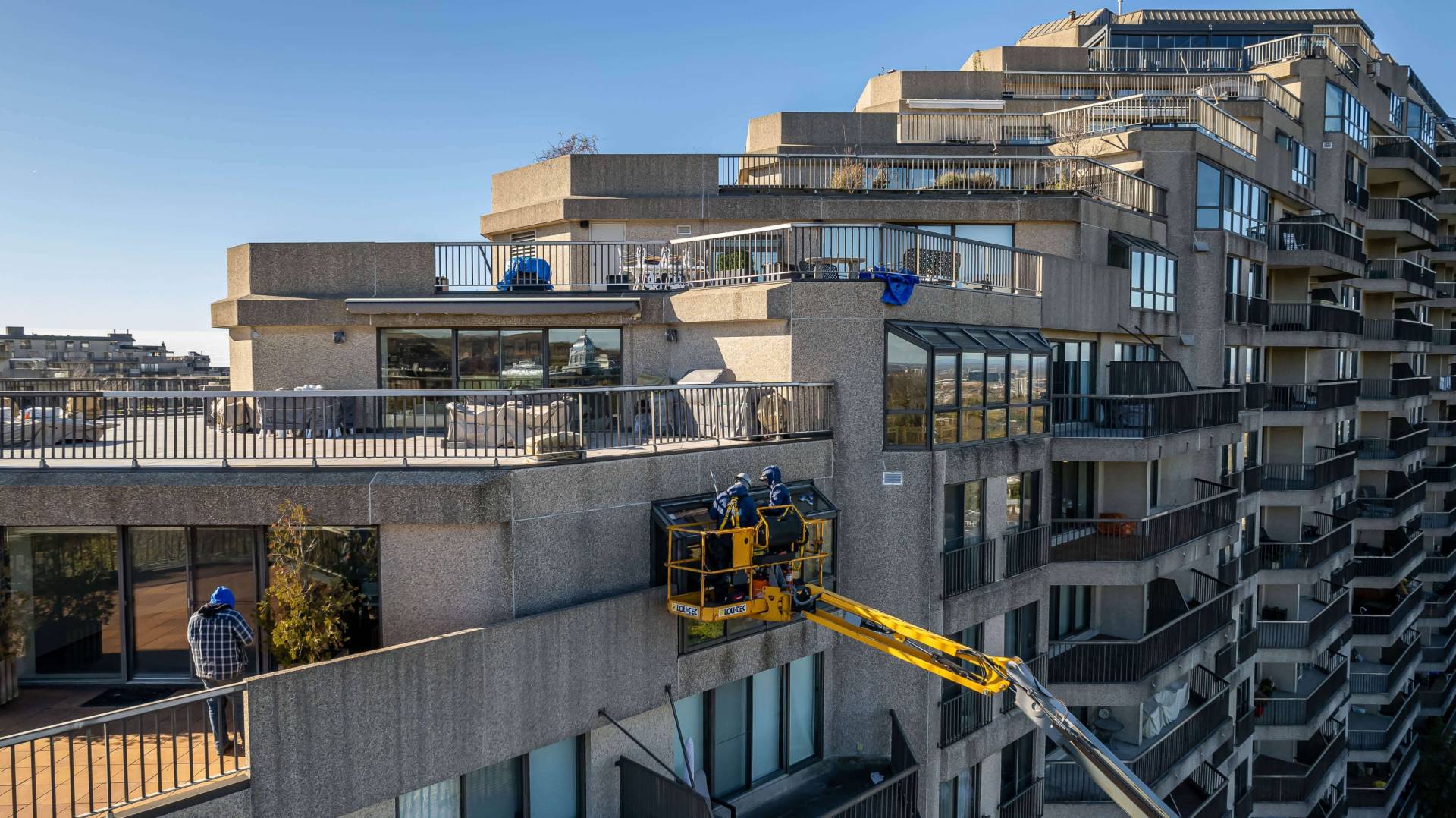 Replacing the windows of a rental building low-budget.